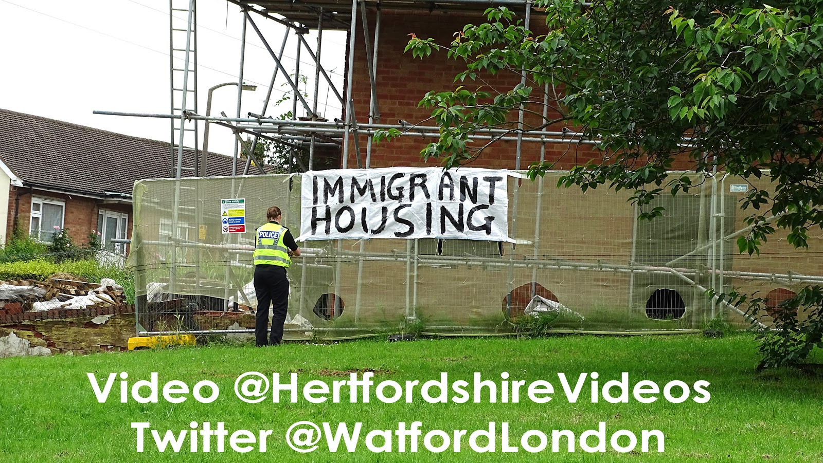 Immigrant Housing Graffiti Banner put on house on the day of the EU ...